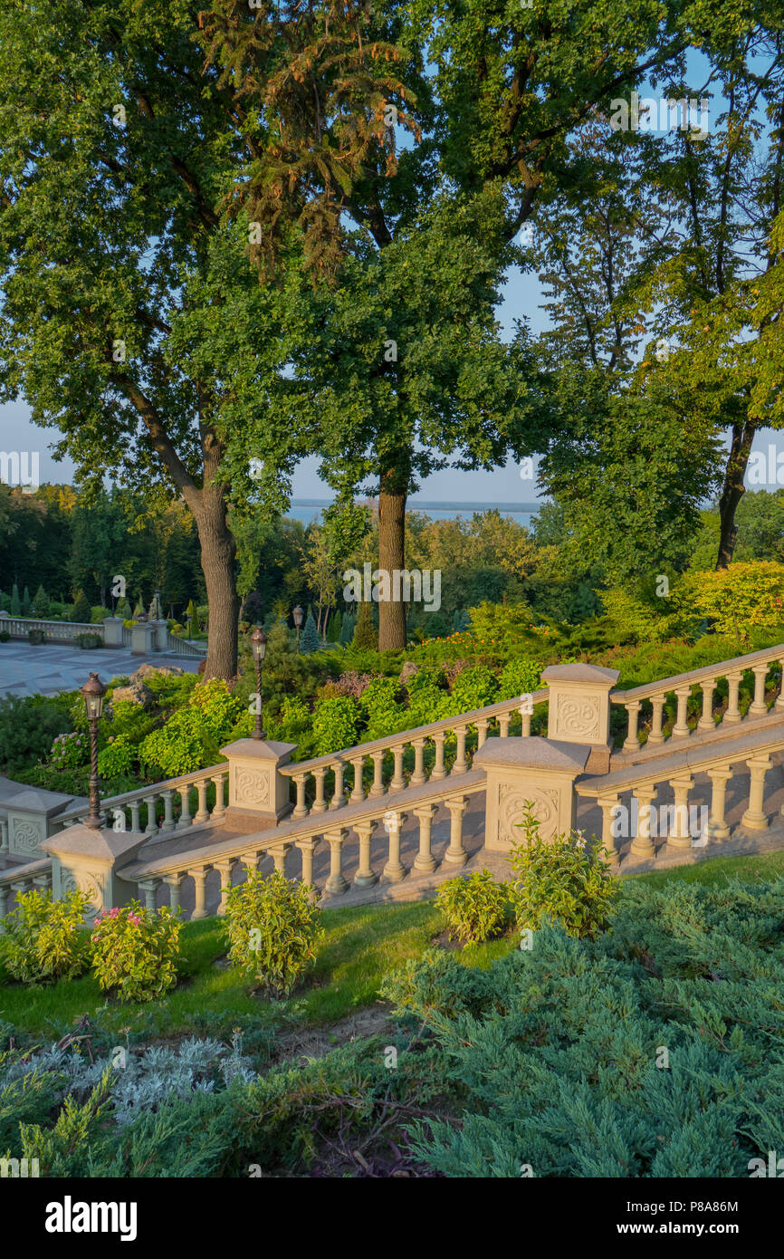 beautiful railing-columns near concrete stairs in a park with green ...