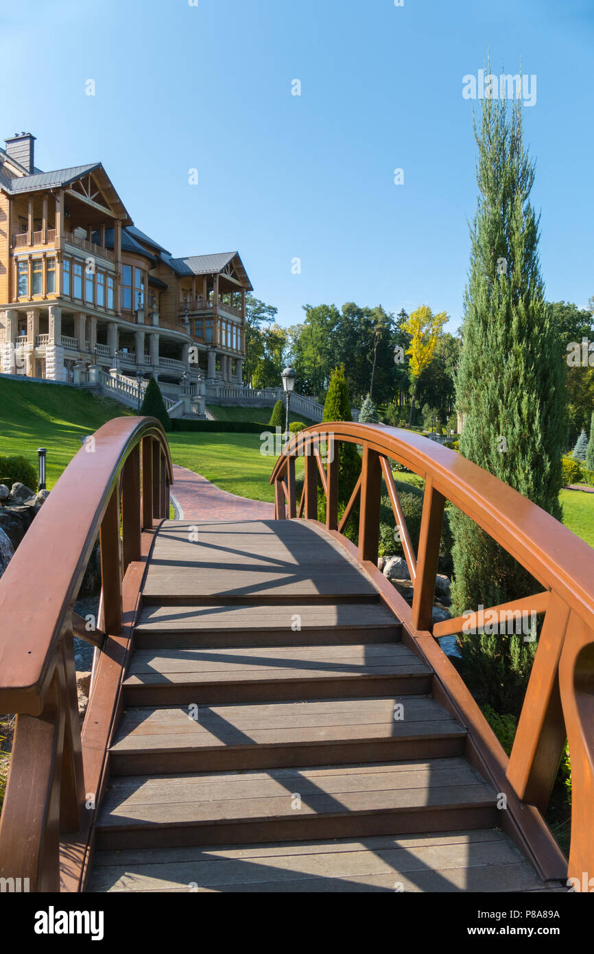beautiful pedestrian bridge with steps going to the park . For your ...