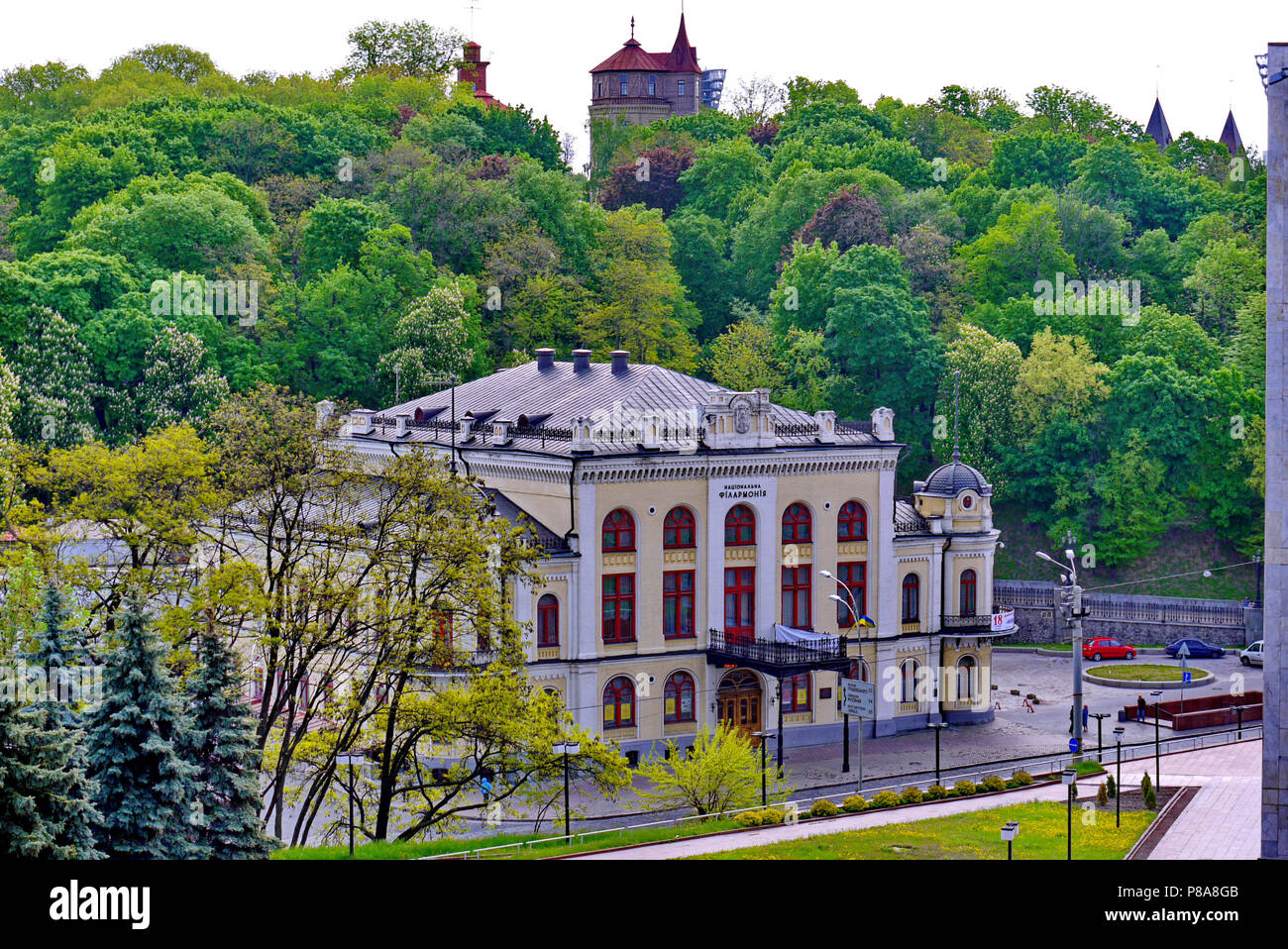 White building of the philharmonic society with red window frames ...