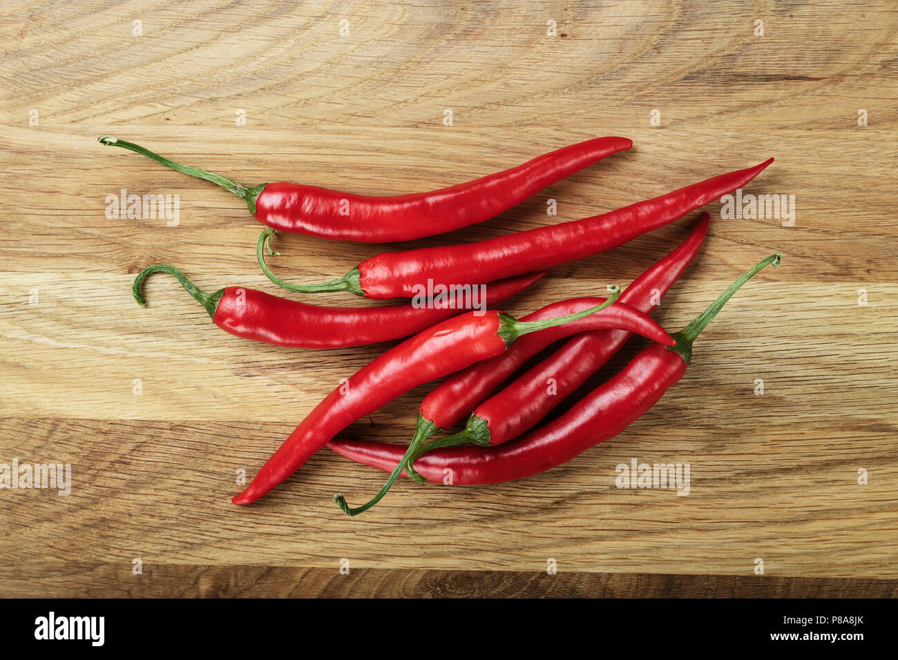 Red hot pepper on a brown wooden background, Mexican cuisine, seasoning ...