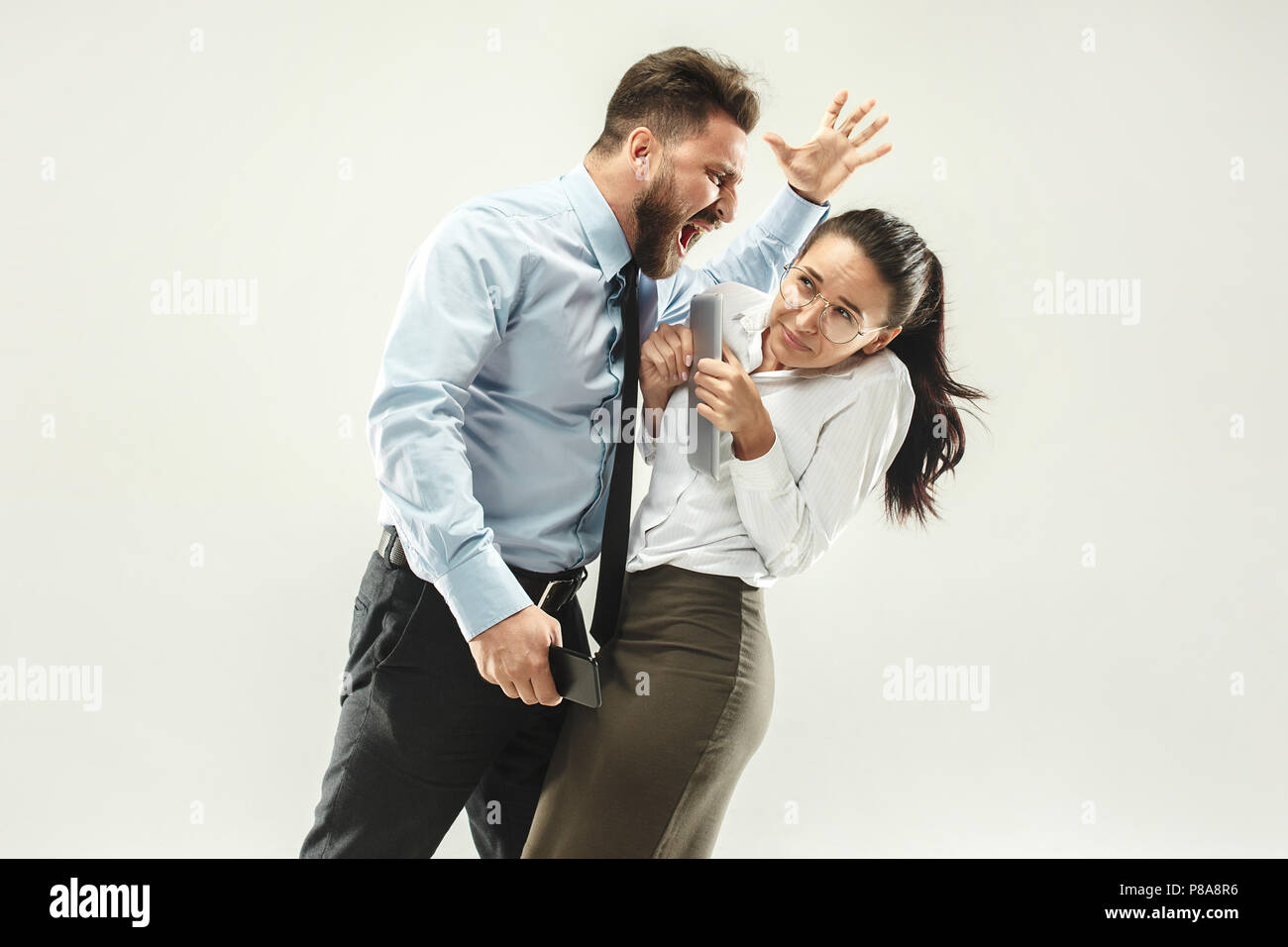 angry businessman and his colleague in the office Stock Photo - Alamy