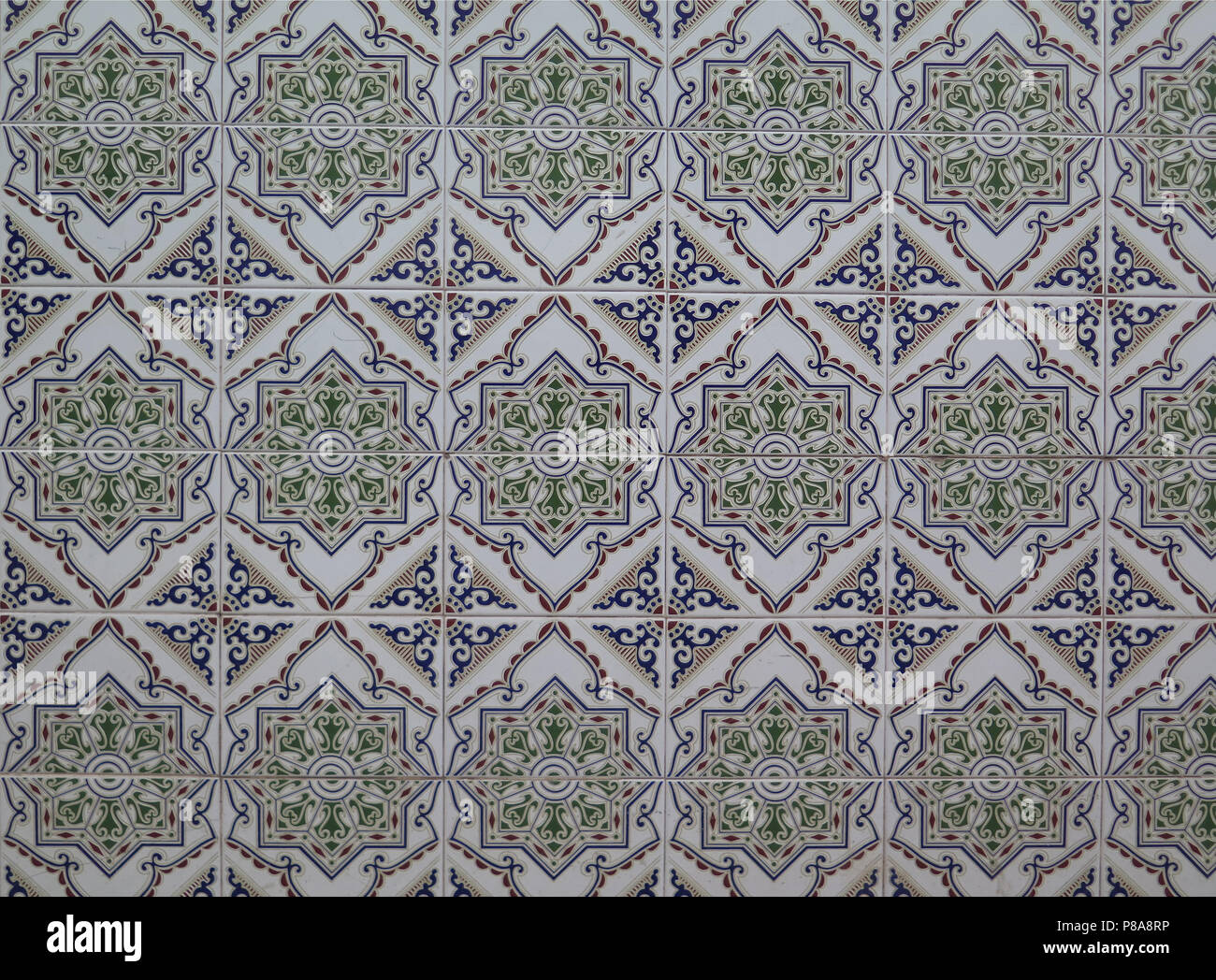 Closeup of Wall tiled with colorful geometrical patterned ceramic tiles ...