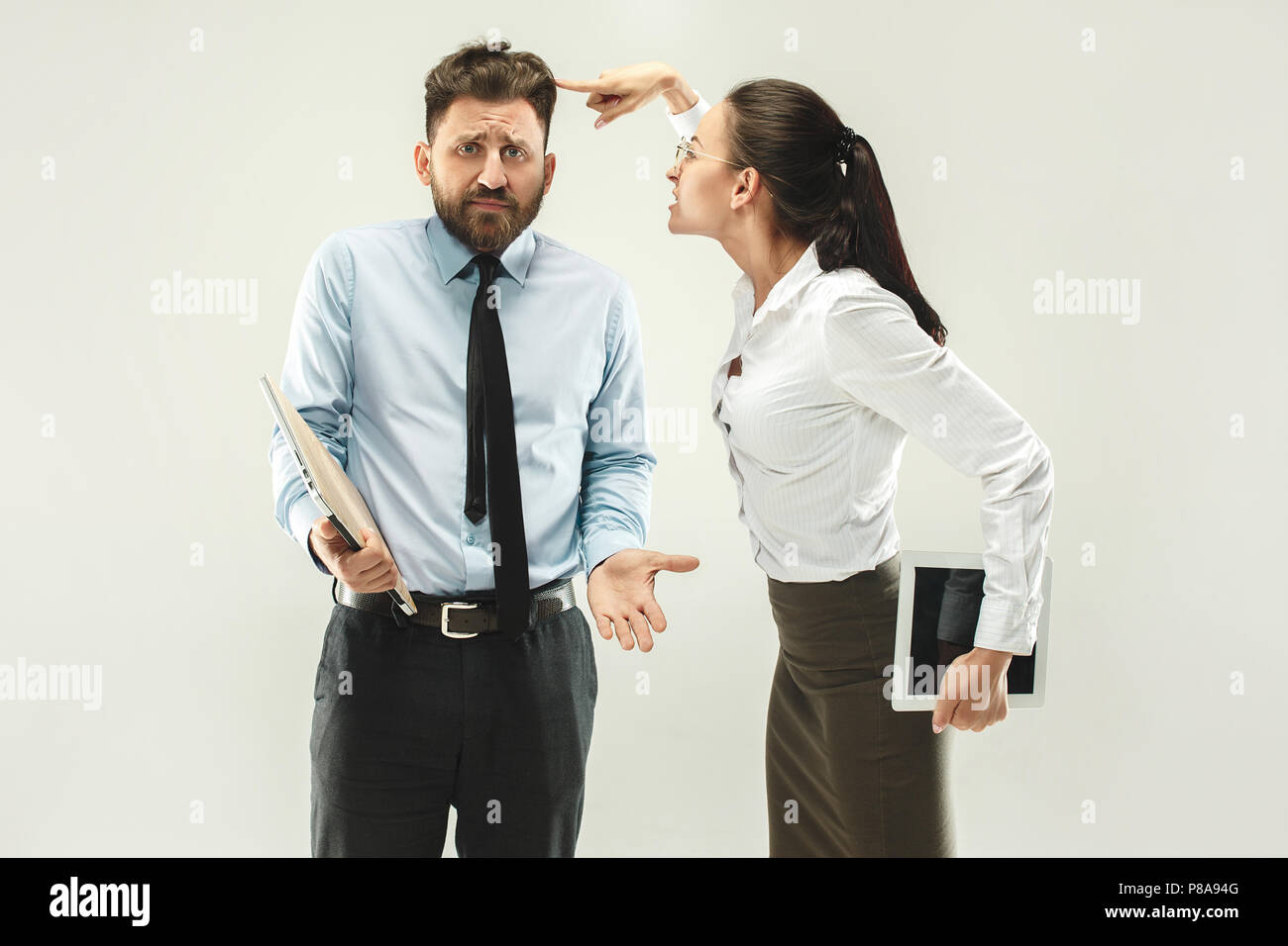 Angry boss. Woman and secretary standing at office or studio Stock ...
