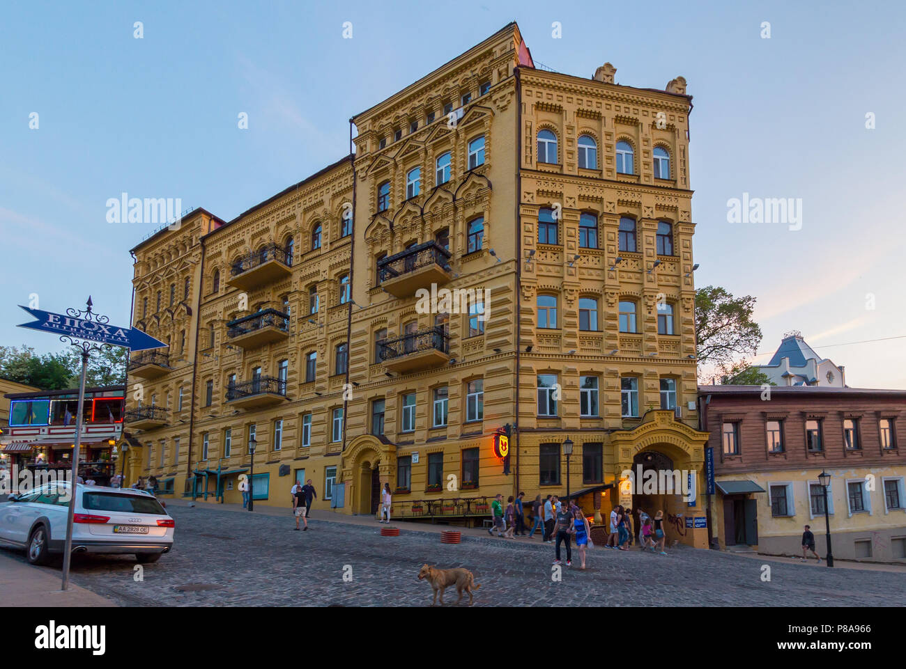 An old five-story building with a stone pavement . For your design ...