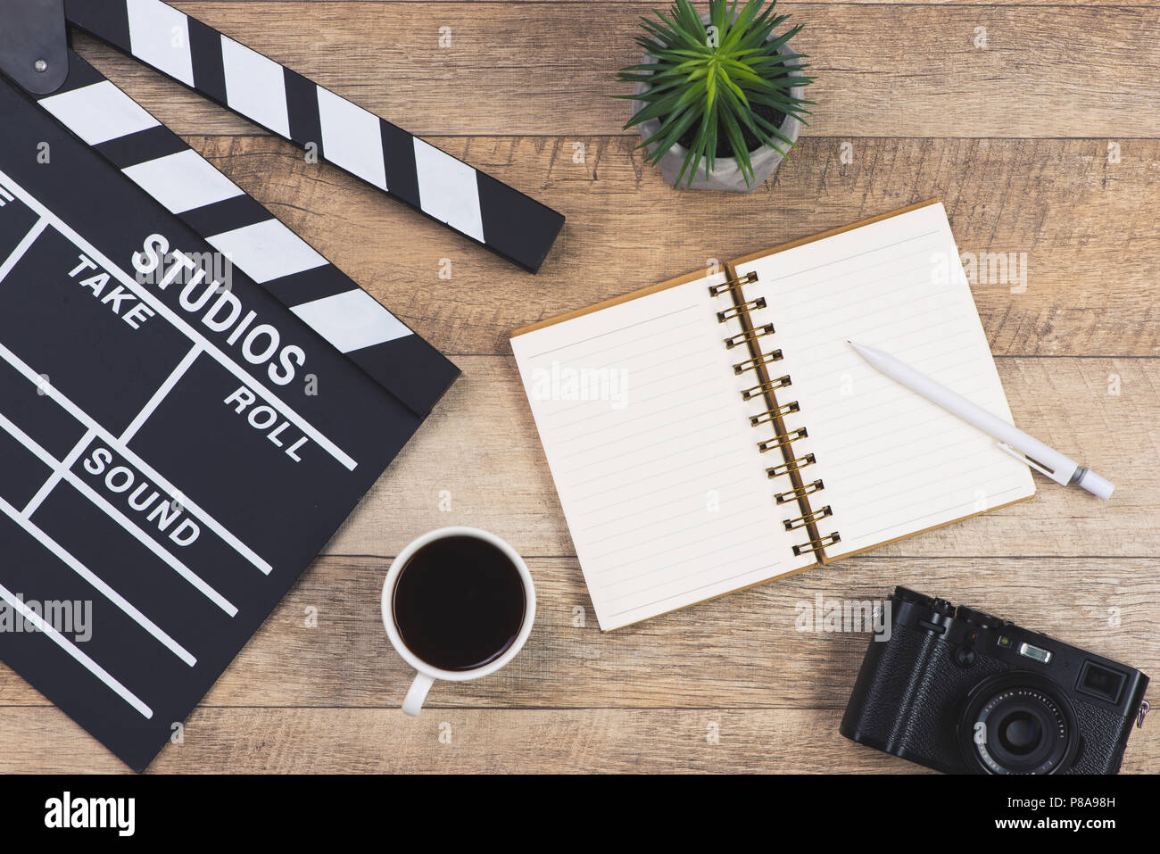 Film director desk with movie clapper board. Top view Stock Photo - Alamy