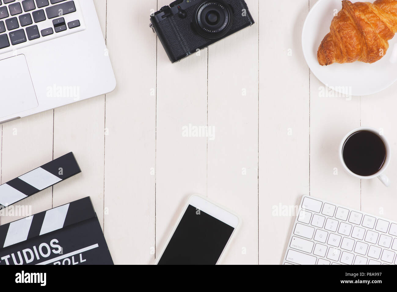 Film director desk with movie clapper board. Top view Stock Photo - Alamy