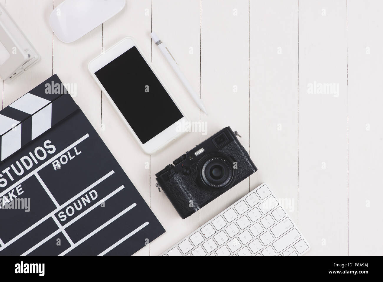 Film director desk with movie clapper board. Top view Stock Photo - Alamy