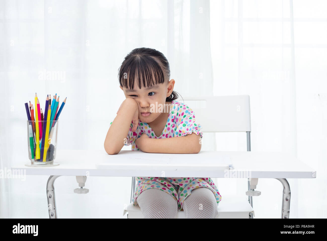 Asian Little Chinese girl doing homework at home Stock Photo - Alamy