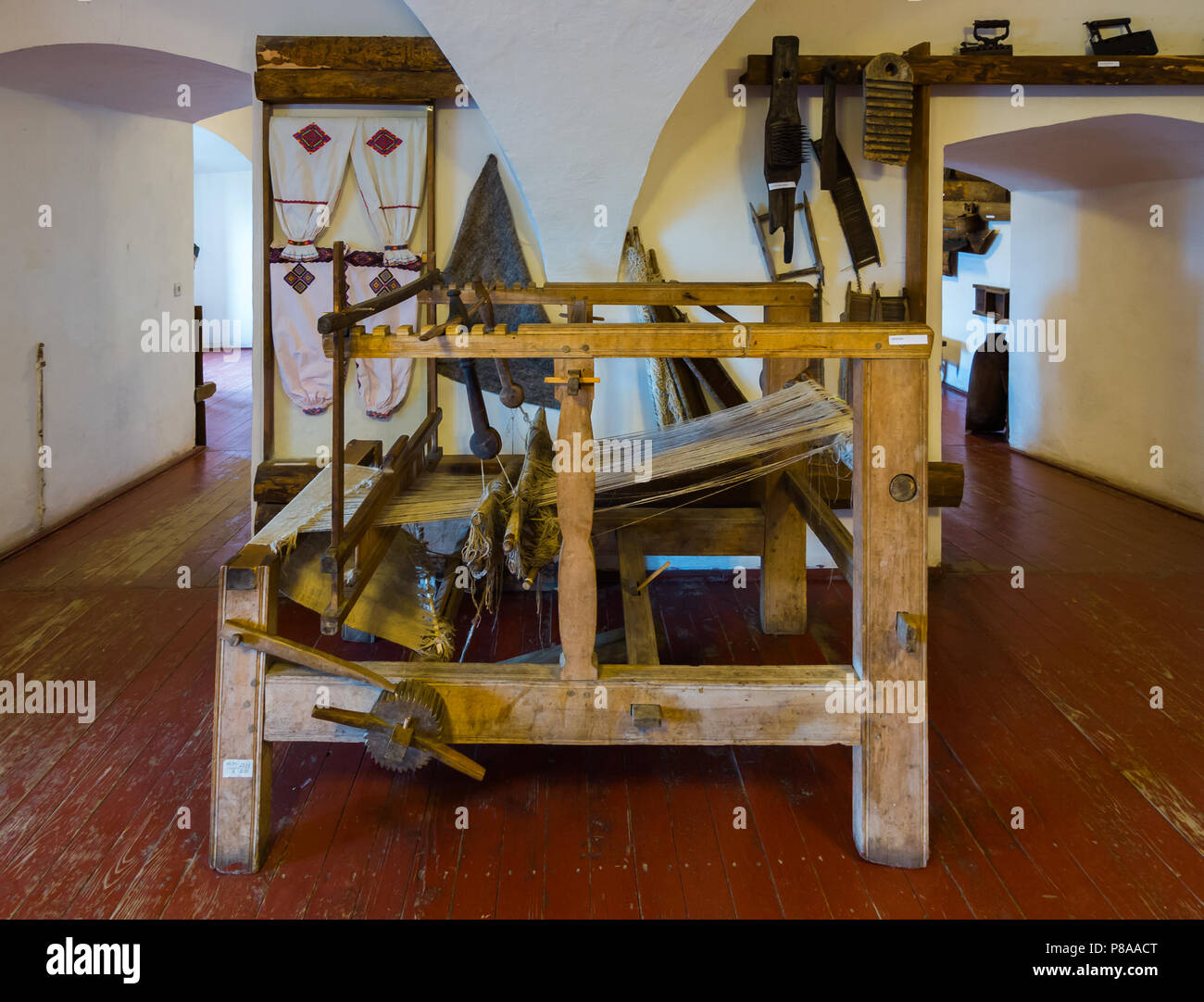 An old wooden spinning wheel. Now this is an exhibit in the museum ...