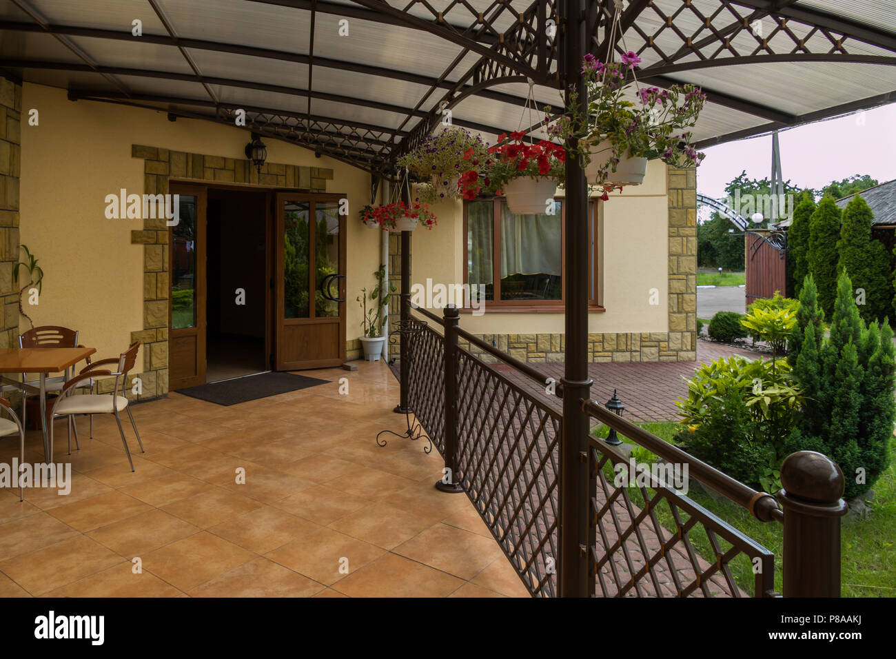 a table for rest under a canopy of a beautiful cafe with a modern ...