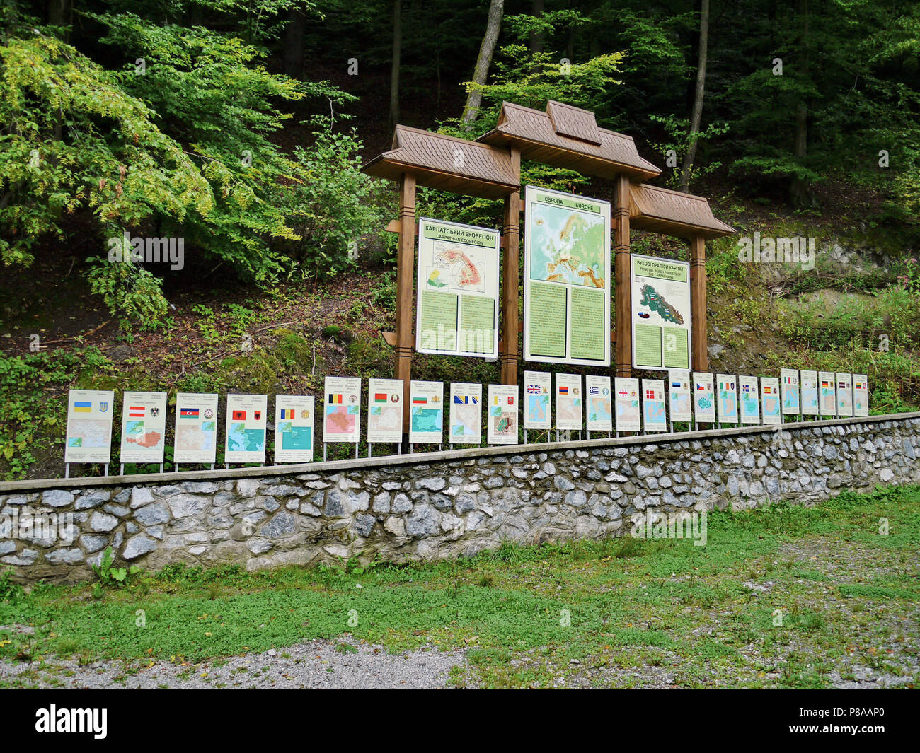 Information board with signs on the background of a mountain slope with ...
