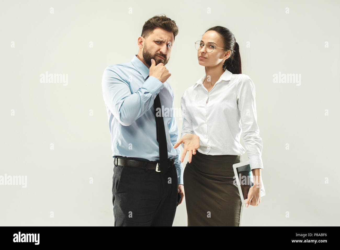 Angry boss. Man and his secretary standing at office or studio Stock ...