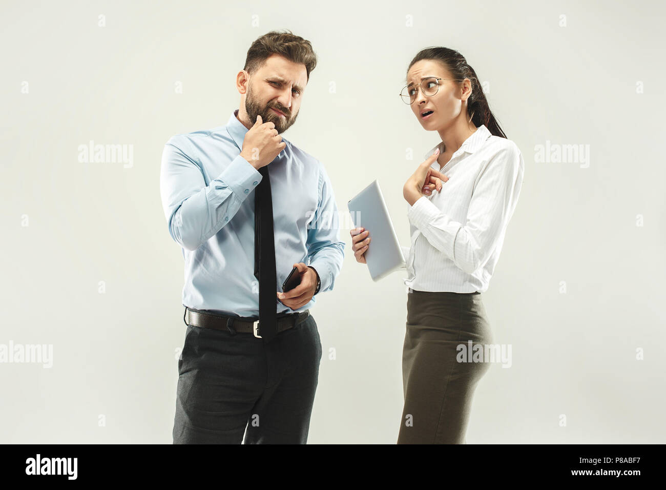 Angry boss. Man and his secretary standing at office or studio Stock ...