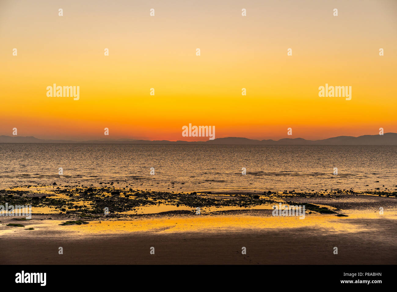 Solway, golden afterglow over Scotland Stock Photo - Alamy