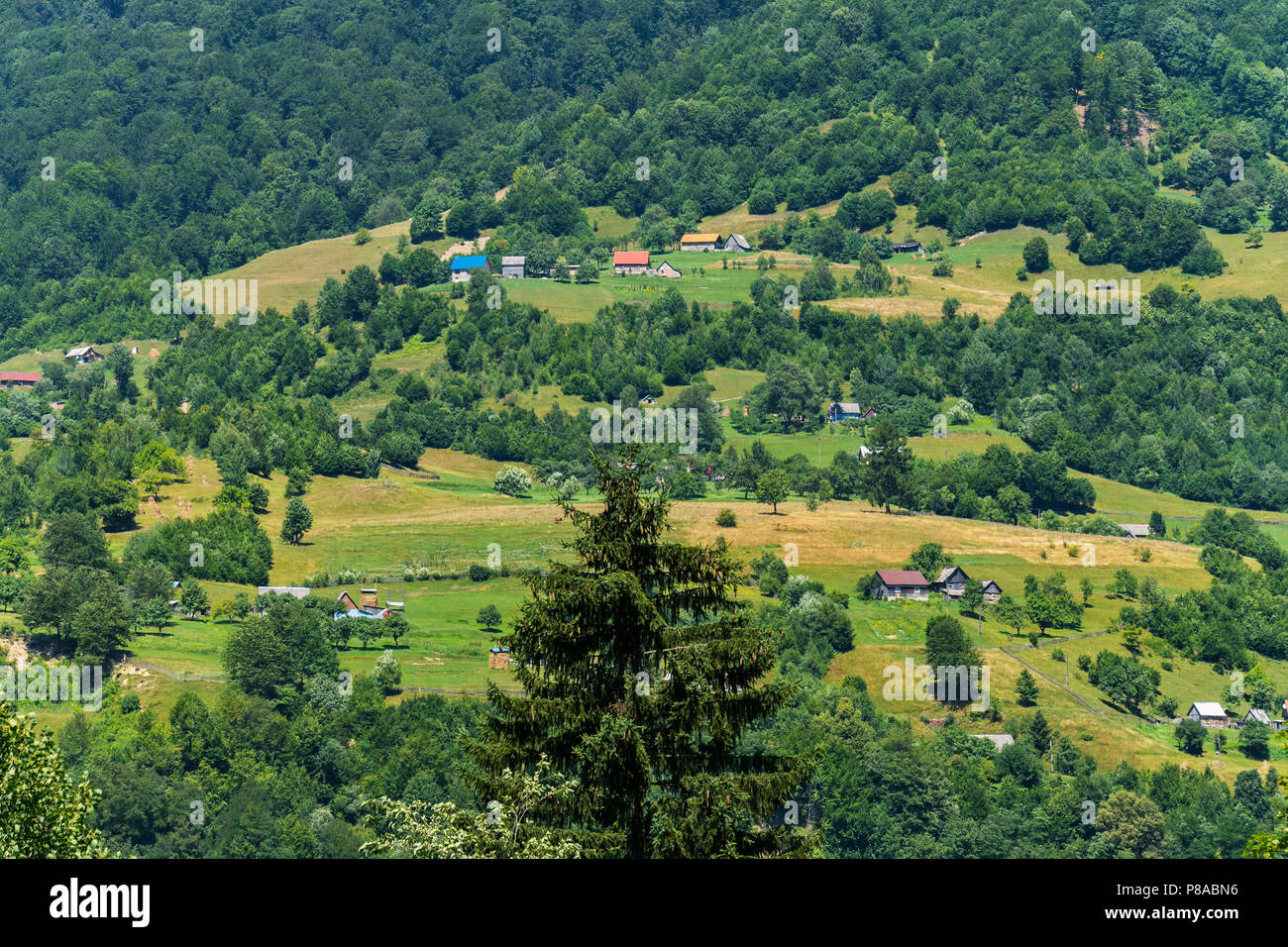 Luxurious landscape of a beautiful mountainous area with chaotic houses ...