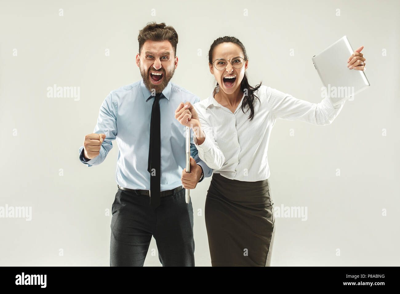 Winning success woman and man happy ecstatic celebrating being a winner ...