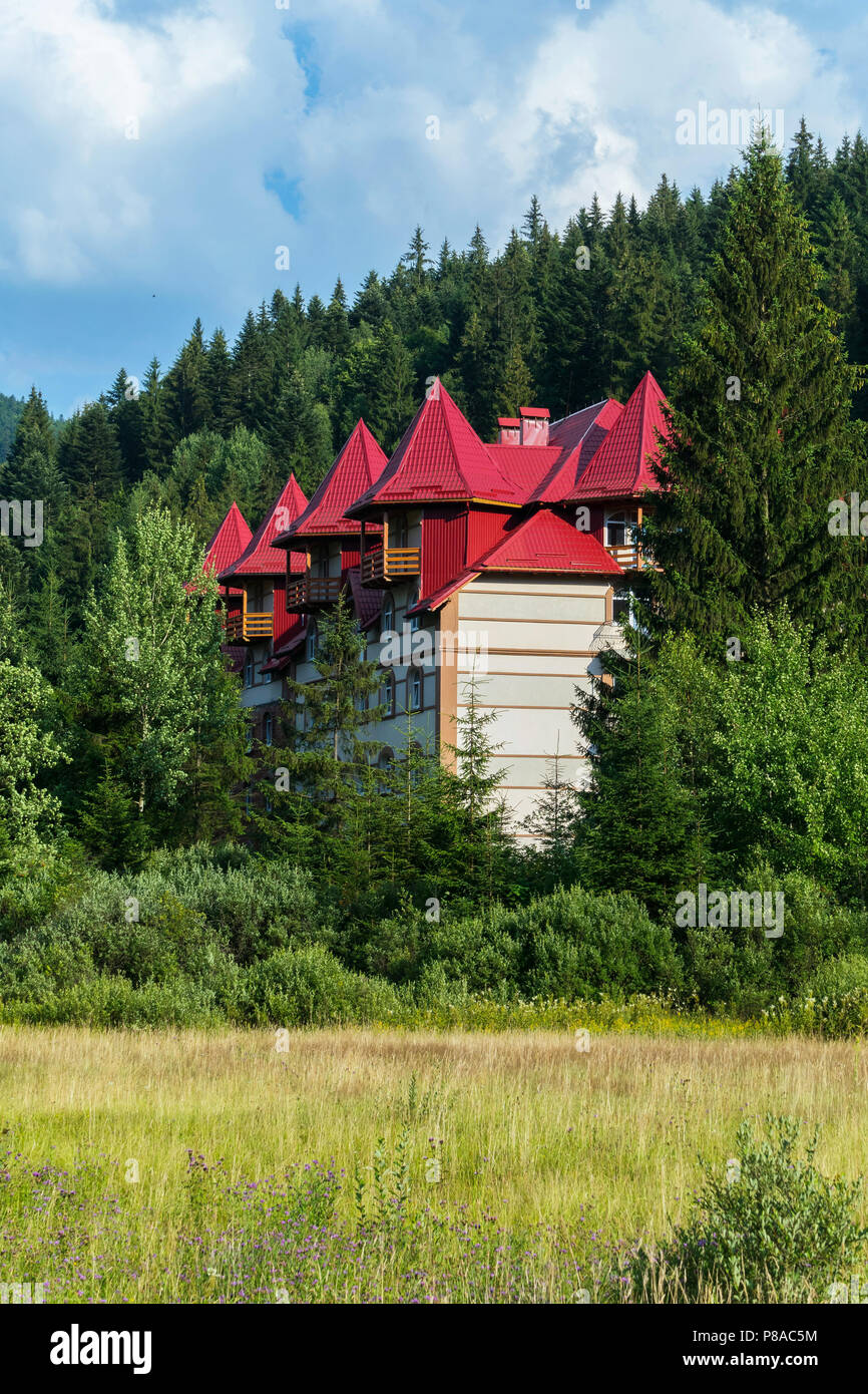 A modern hotel building with beautiful architecture red turrets from ...