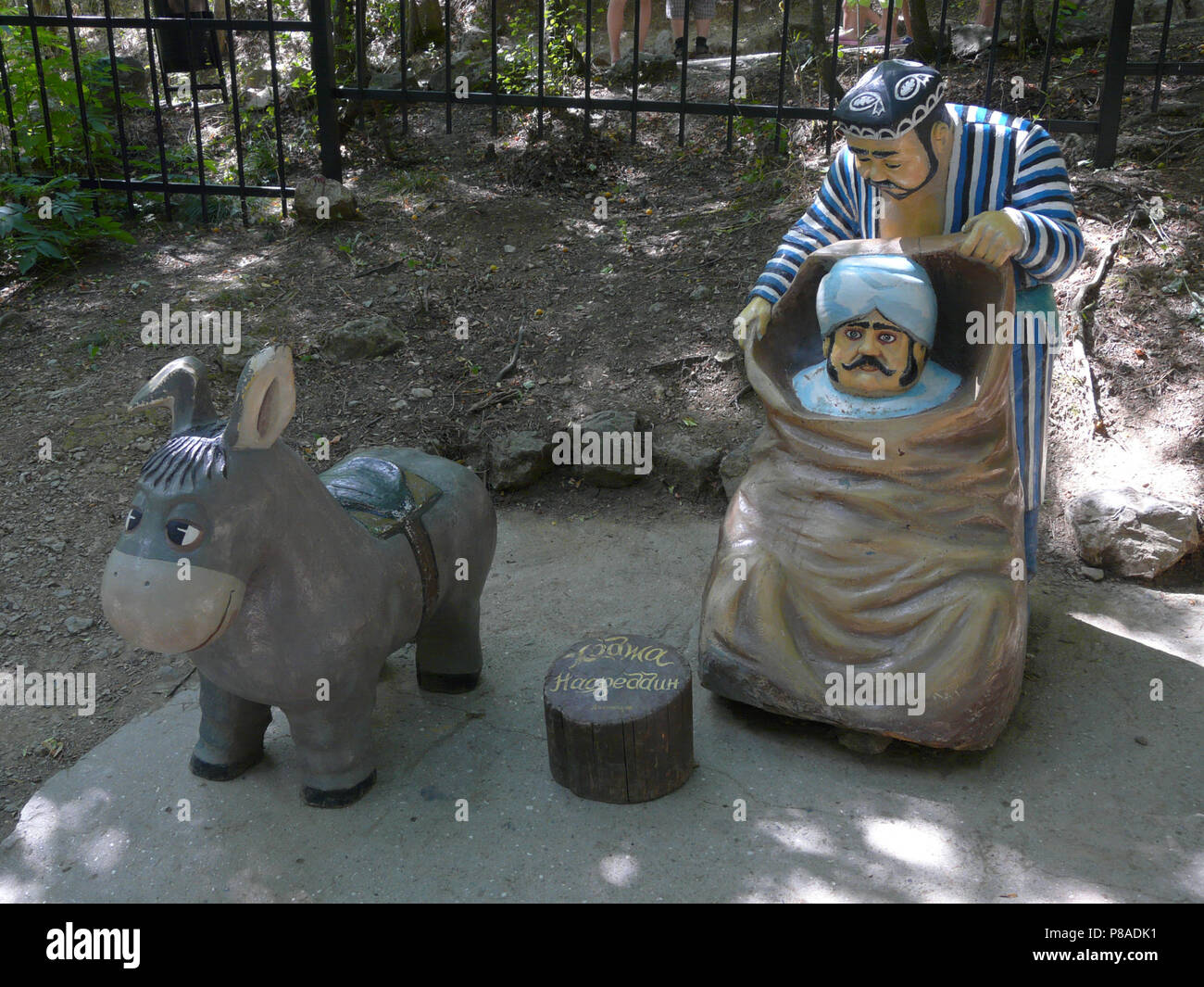 Funny exhibition with two, one of them in a bag of men and a donkey ...