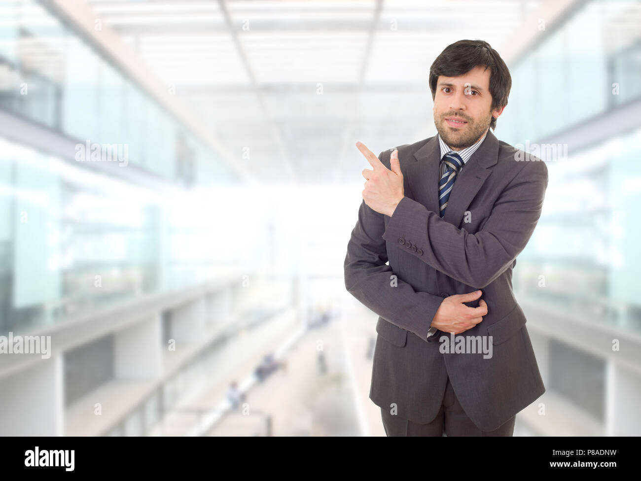happy business man pointing, at the office Stock Photo - Alamy