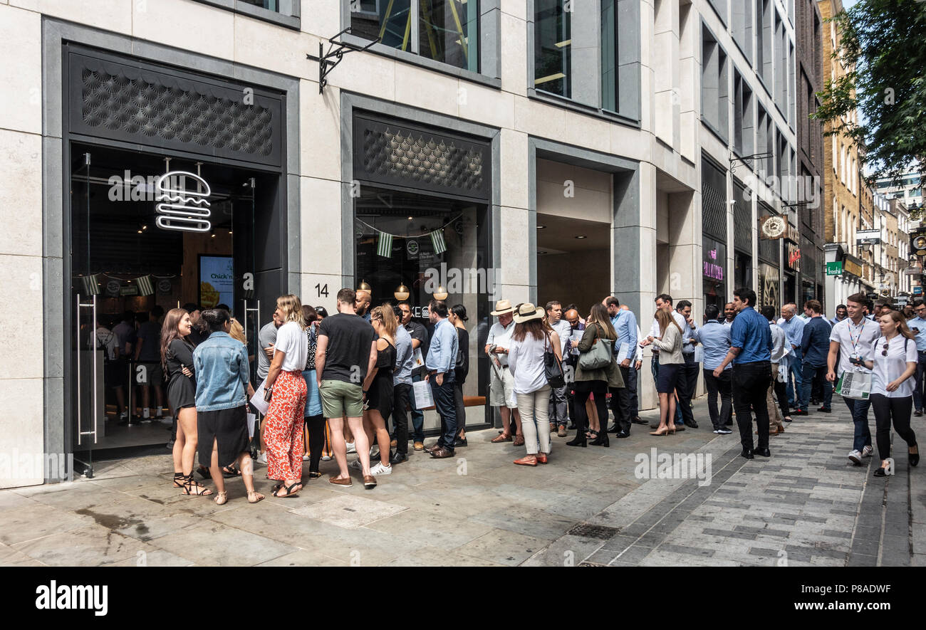 A long queue of people waiting outside the Shake Shack restaurant in ...
