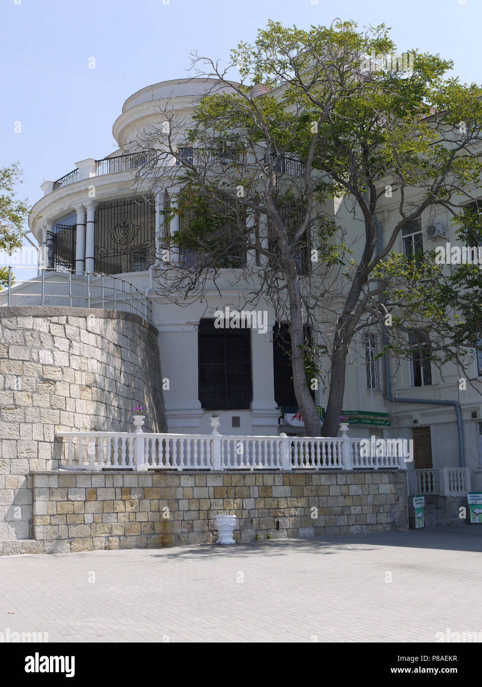 a house with columns and a balcony on the second floor and access to ...