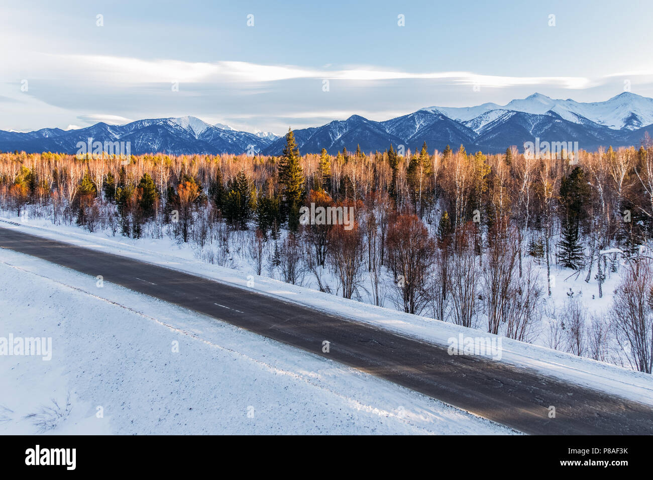 beautiful winter road with trees and snow covered mountains, russian ...