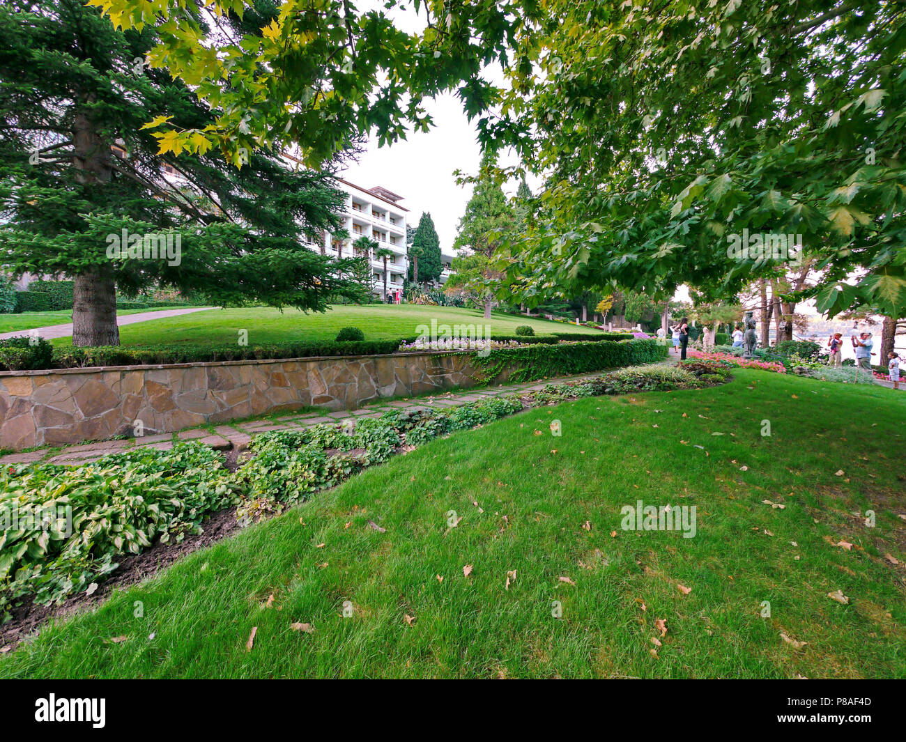 park area with alleys and a cropped lawn in front of the new beautiful ...