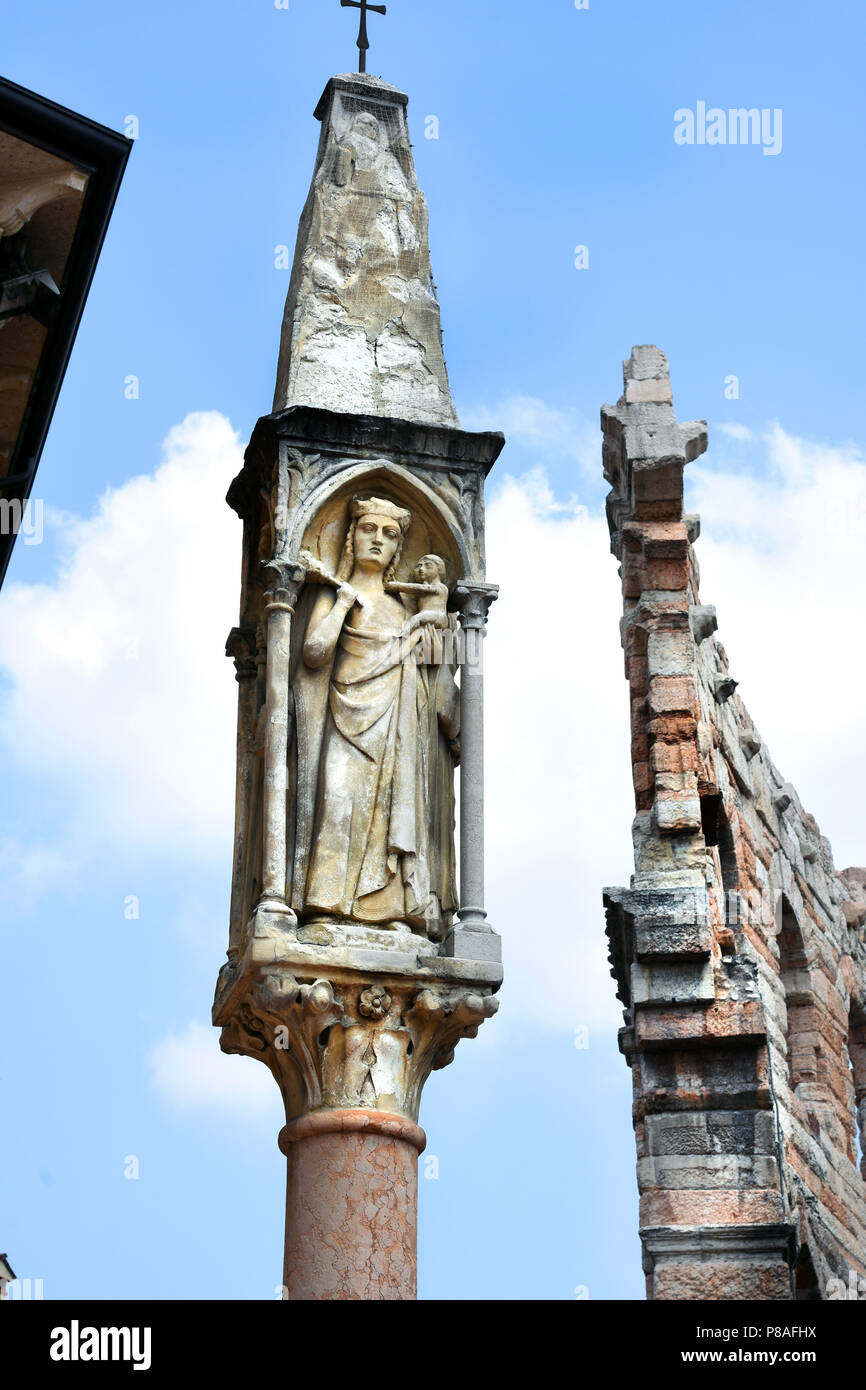 medieval column with Aedicule of madonna. Roman colosseum the Arena ...
