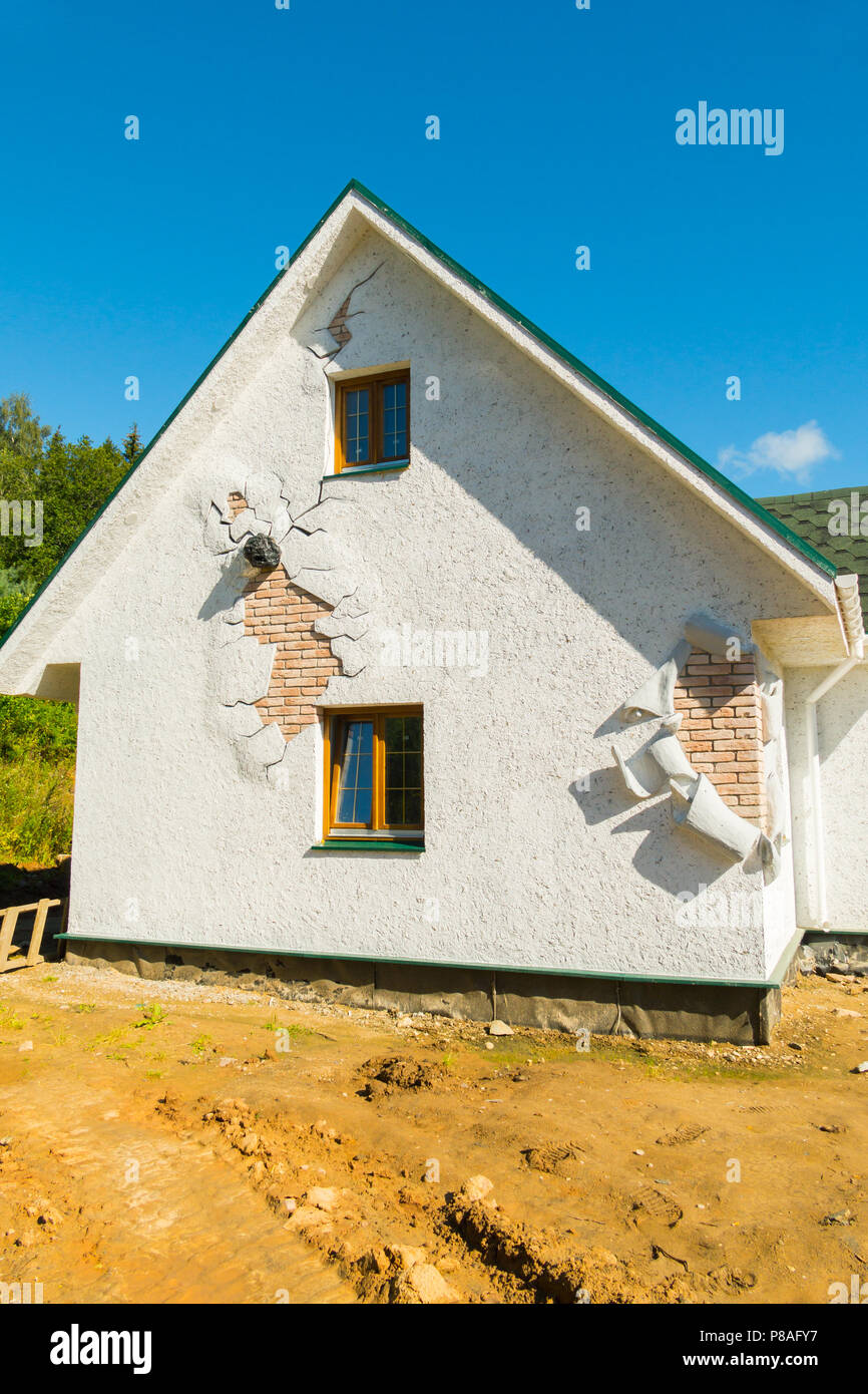 the facade of the house with a simulated gunfire and covered walls ...