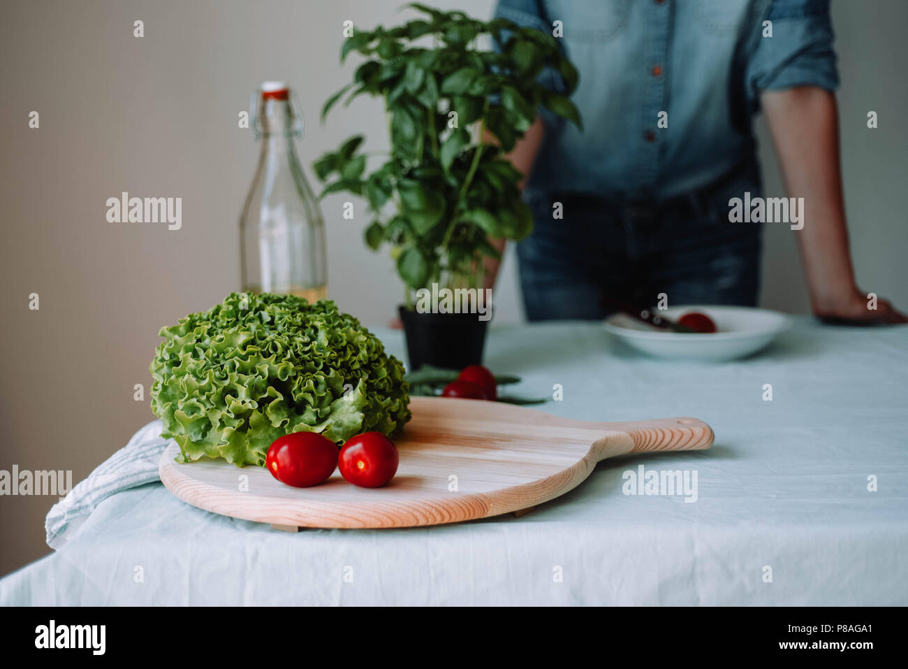 Woman kitchen eating jeans hi-res stock photography and images - Alamy