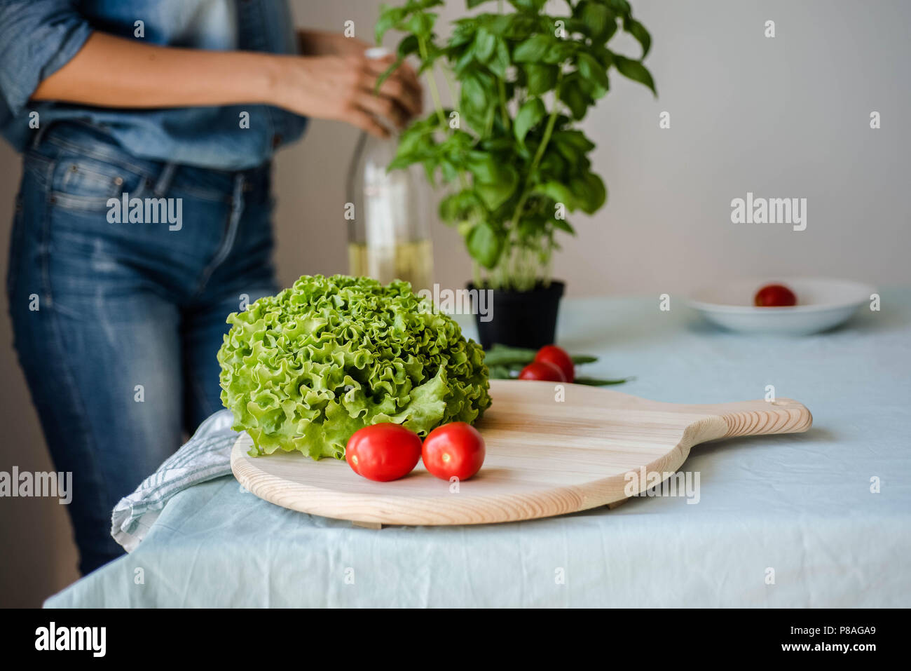 Woman kitchen eating jeans hi-res stock photography and images - Alamy