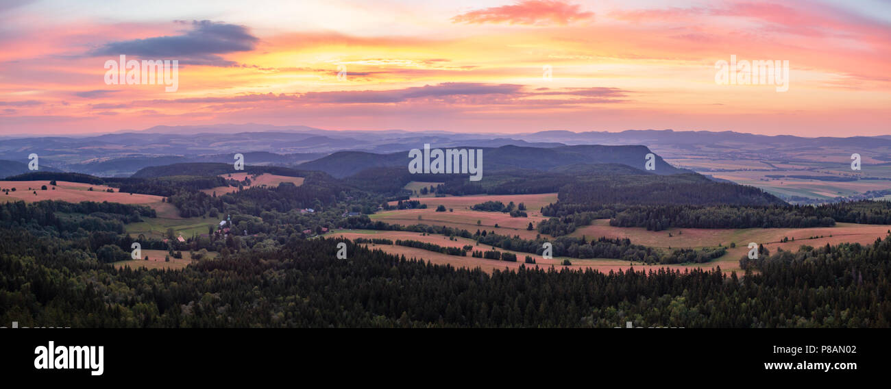Sunset panorama, landscape with green forest and beautiful ...