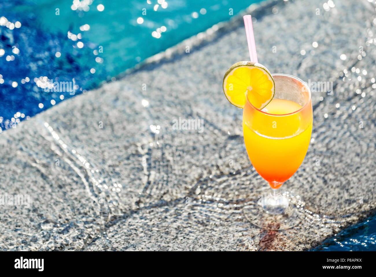 alcohol cocktail at the edge of the pool Stock Photo - Alamy