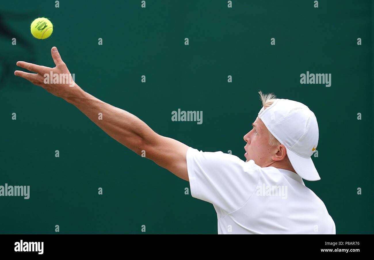Anton Matusevich serves on day eight of the Wimbledon Championships at ...