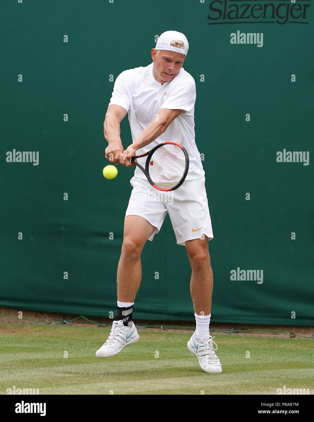 Anton Matusevich in action on day eight of the Wimbledon Championships ...