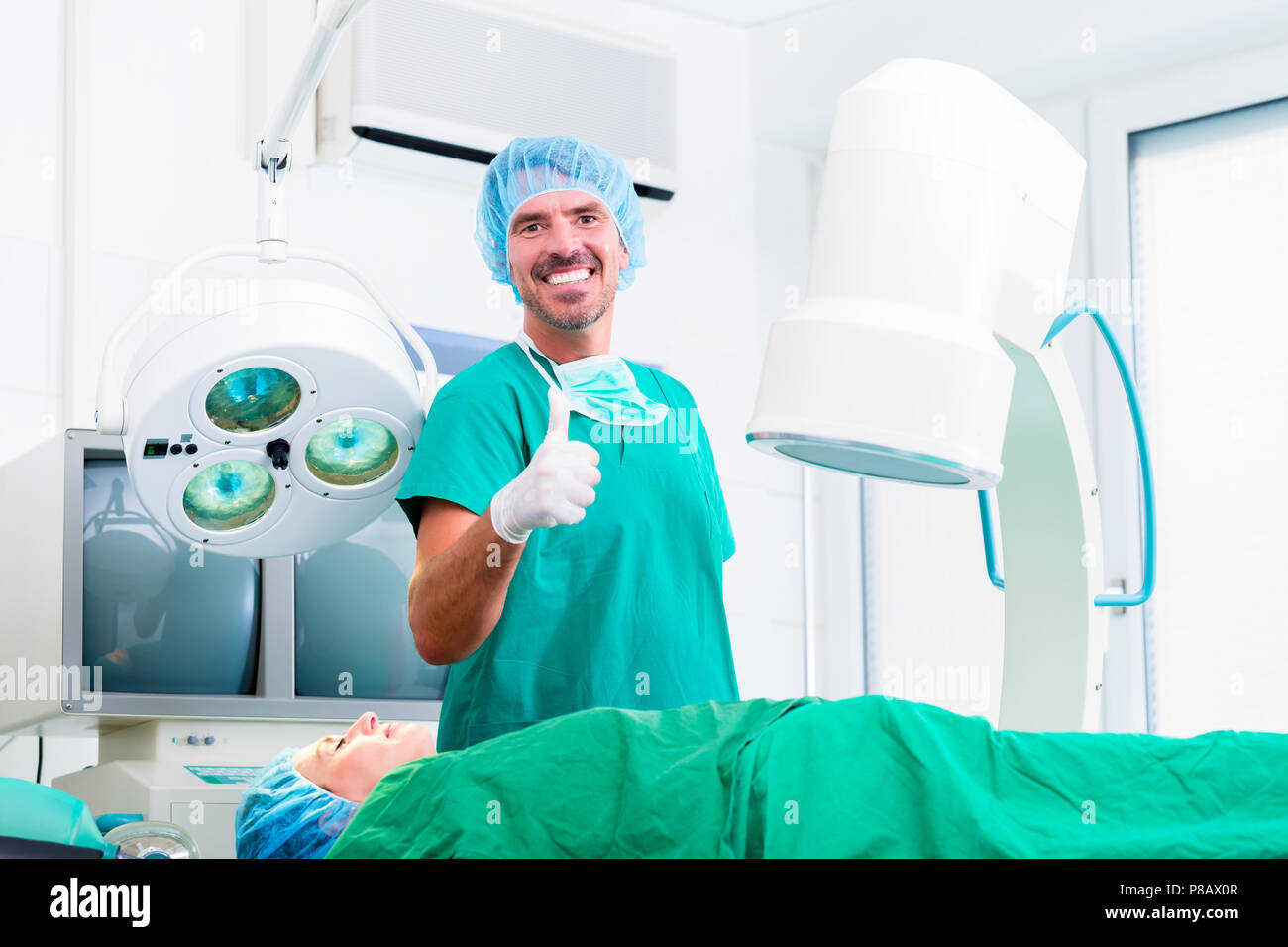 Doctor having successful operation in operating room Stock Photo - Alamy
