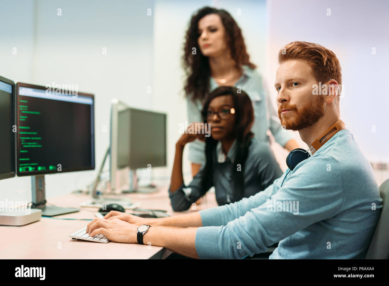 Software engineers working on project and programming in company Stock Photo - Alamy