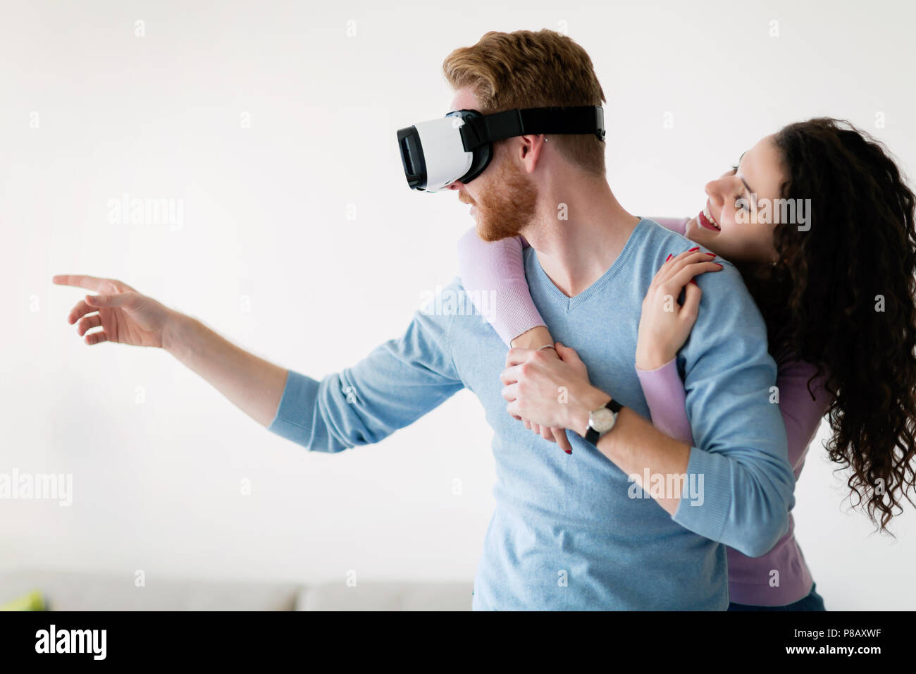 Happy young man virtual reality hi-res stock photography and images - Alamy