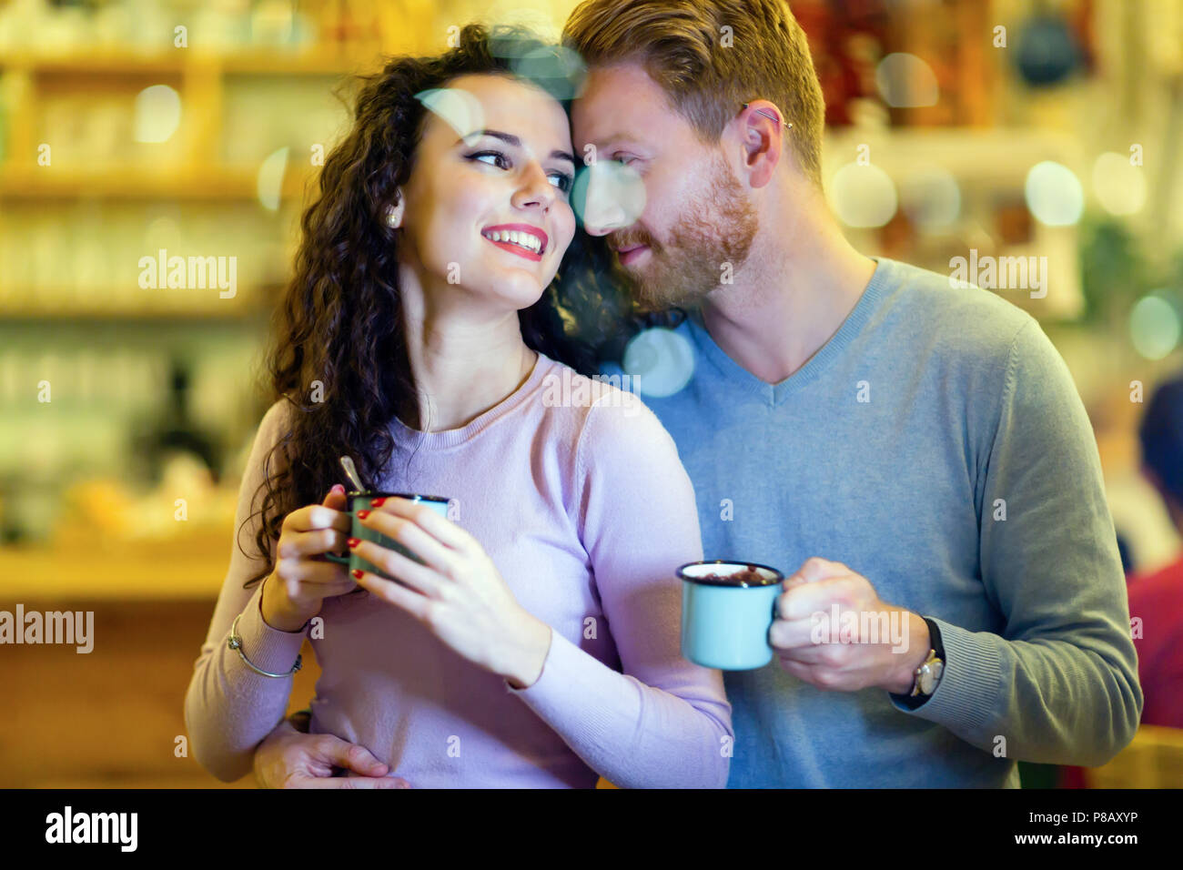 Romantic couple having date in coffee shop Stock Photo - Alamy