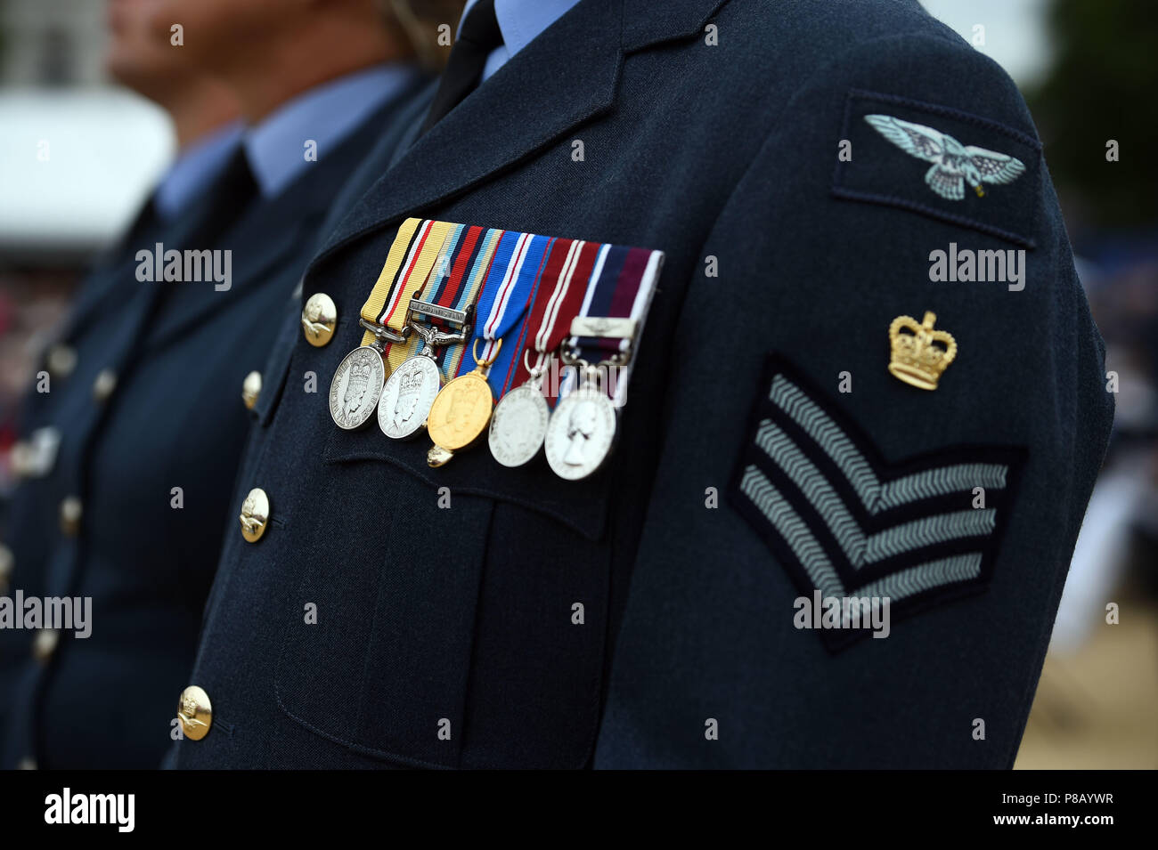 A RAF veteran's medals during a flypast of 100 RAF aircraft over ...