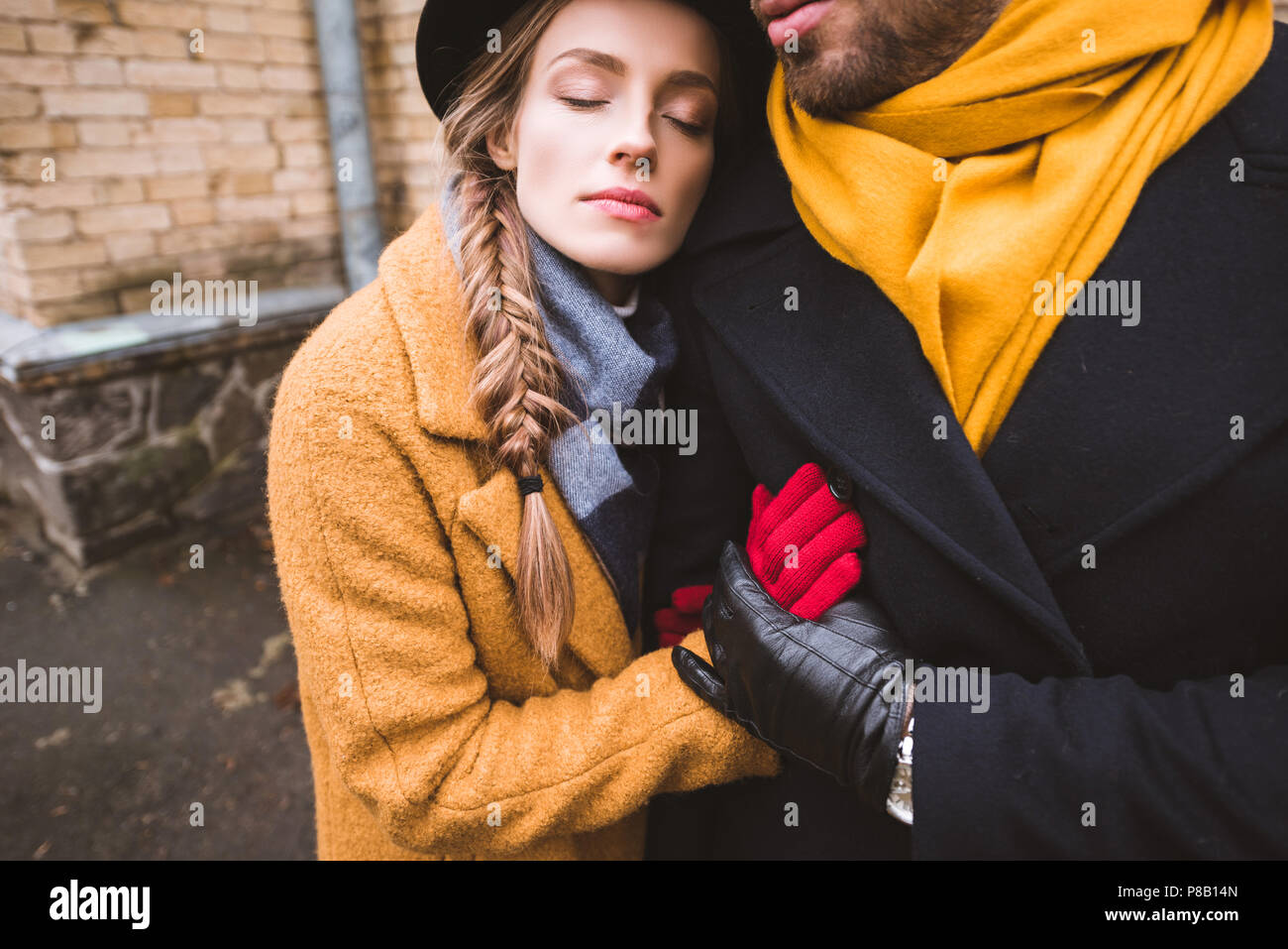 cropped image of beautiful hugging couple in autumn outfit Stock Photo ...