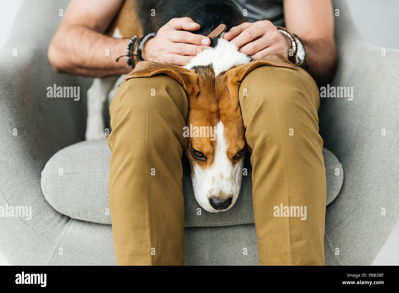 Hands between legs hi-res stock photography and images - Alamy