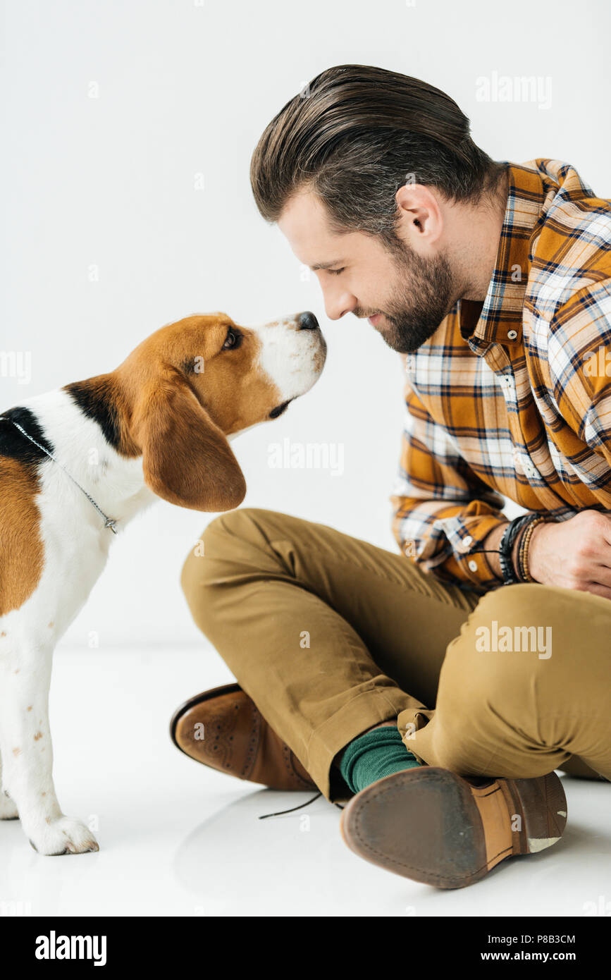 side view of dog sniffing man nose Stock Photo - Alamy