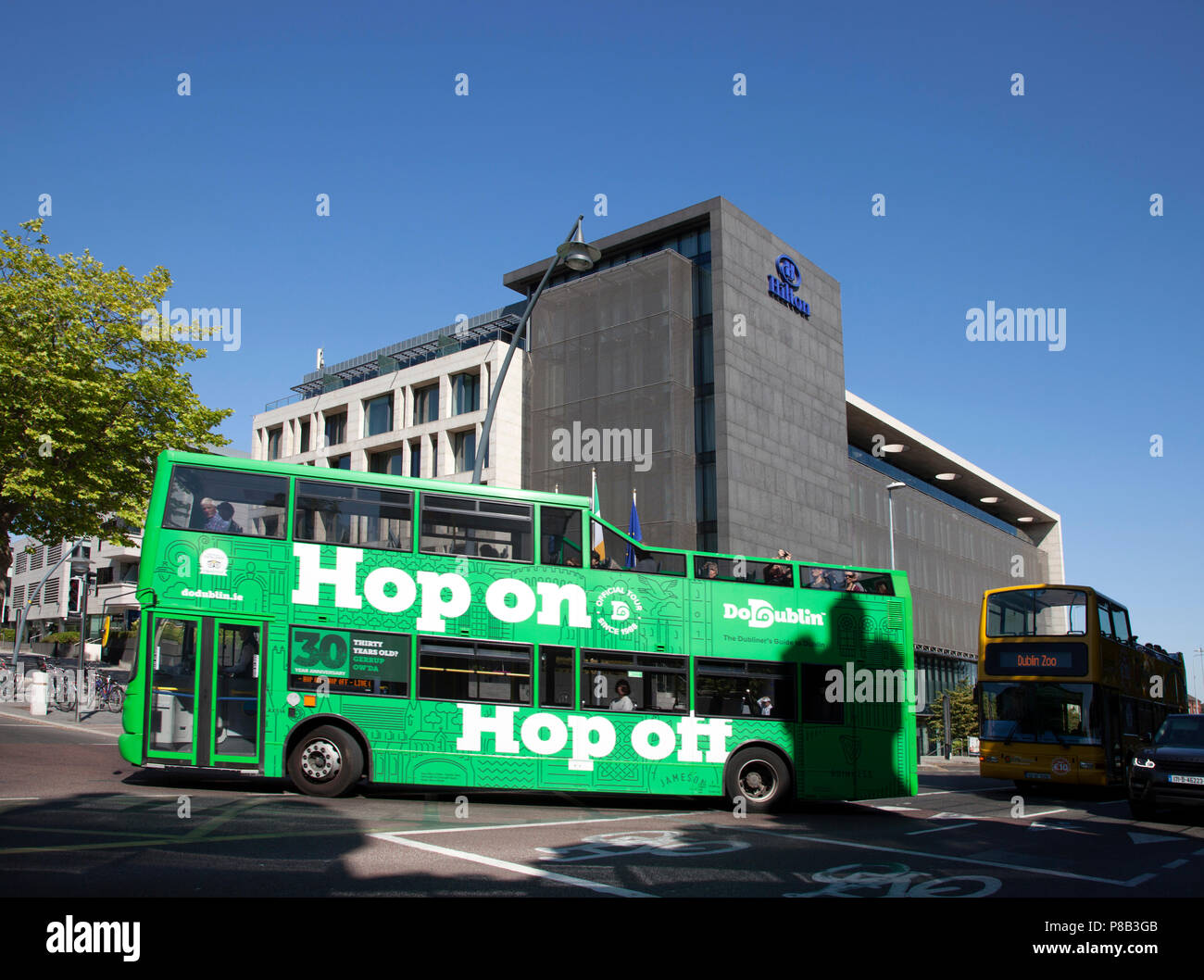 Dublin Hop On Hop Off tourist bus passes the Hilton Hotel, Kilmainham ...