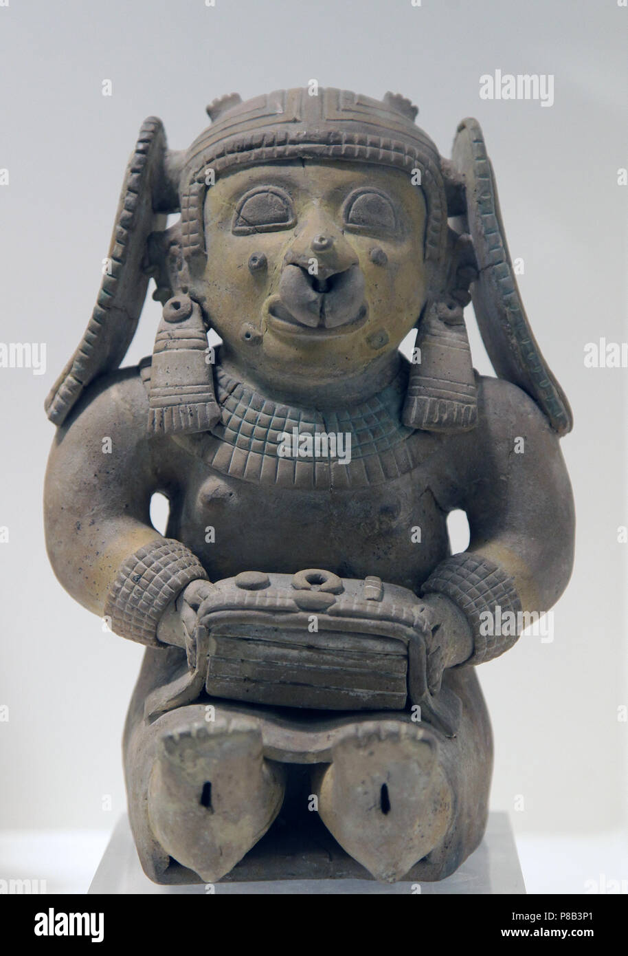 Ceramic figurine in the shape of a human figure.Representative of the ...