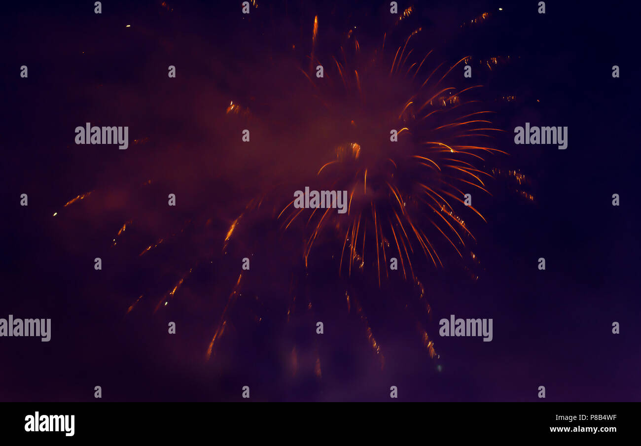 orange fireworks traces in night sky Stock Photo - Alamy