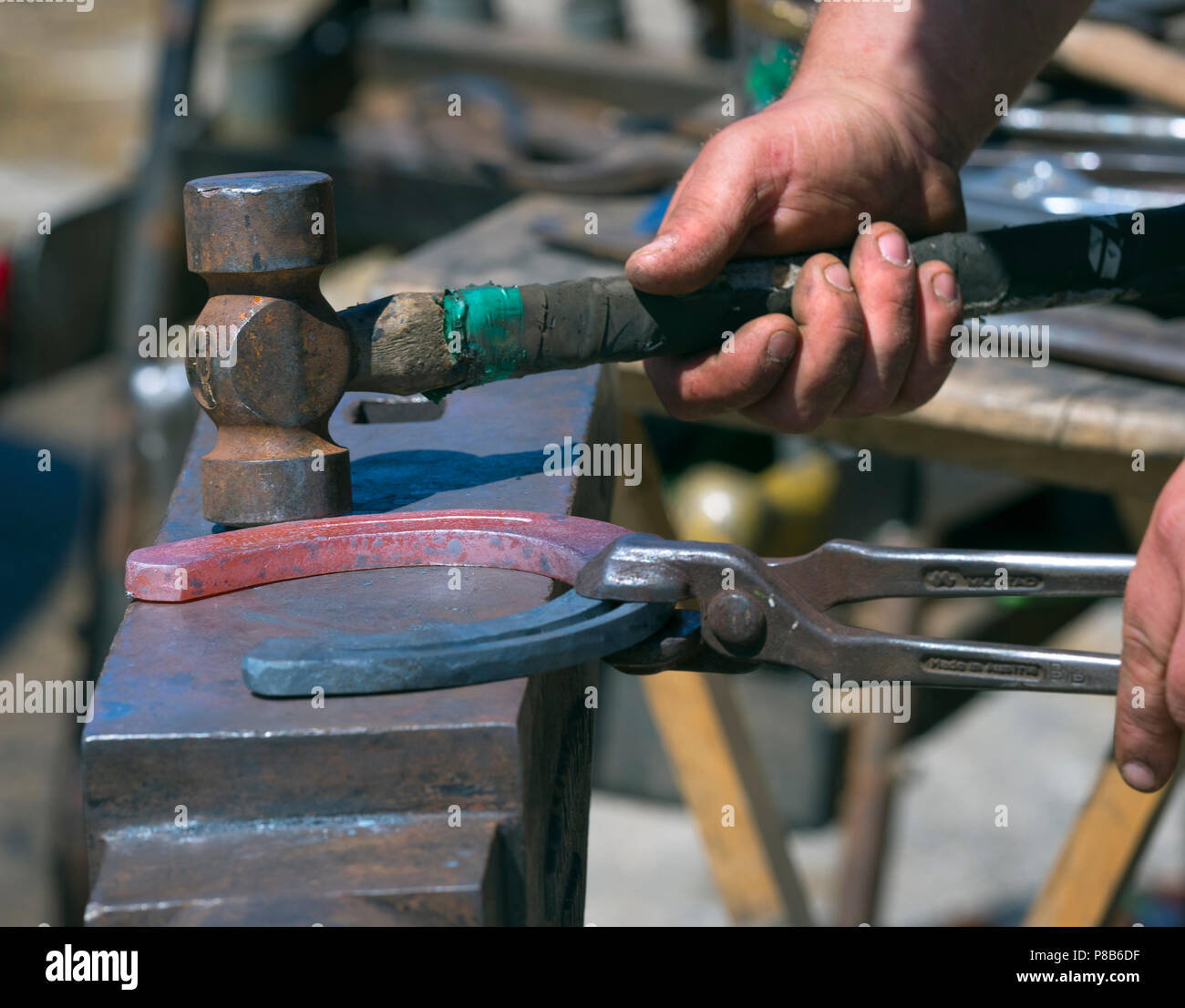 Farrier at work shoeing pony in Norfolk village Stock Photo - Alamy