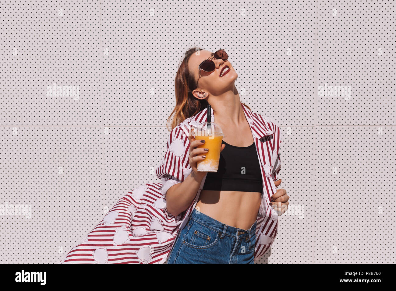 sensual young woman with mango shake in plastic cup Stock Photo - Alamy