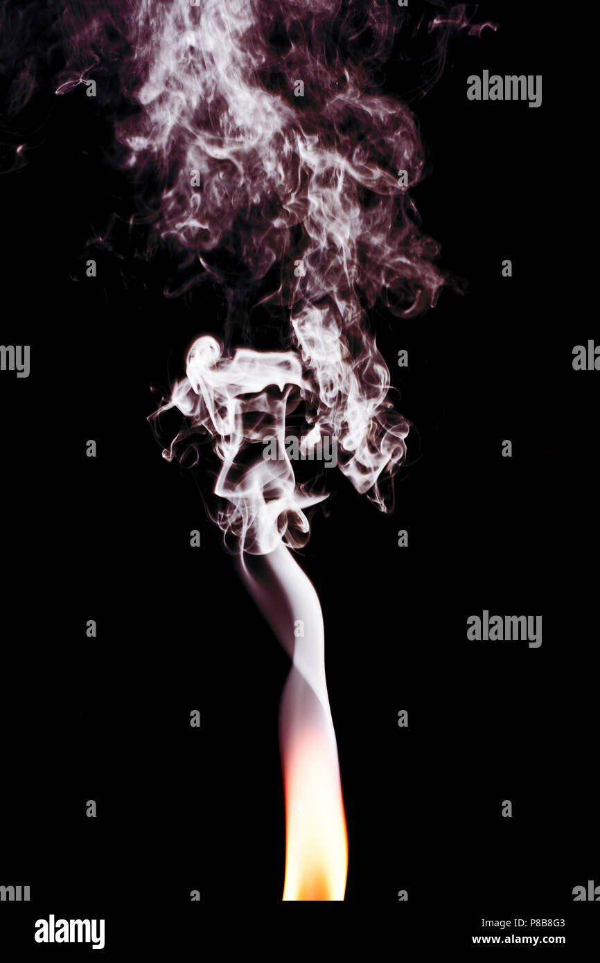 flame isolated on black background leading trails of lightly colored ...