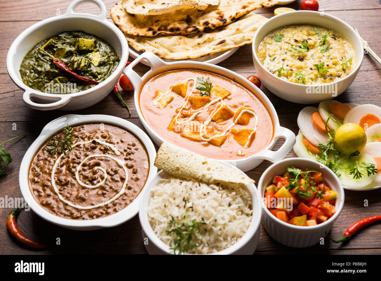 Assorted indian food for lunch or dinner, rice, lentils, paneer, dal ...